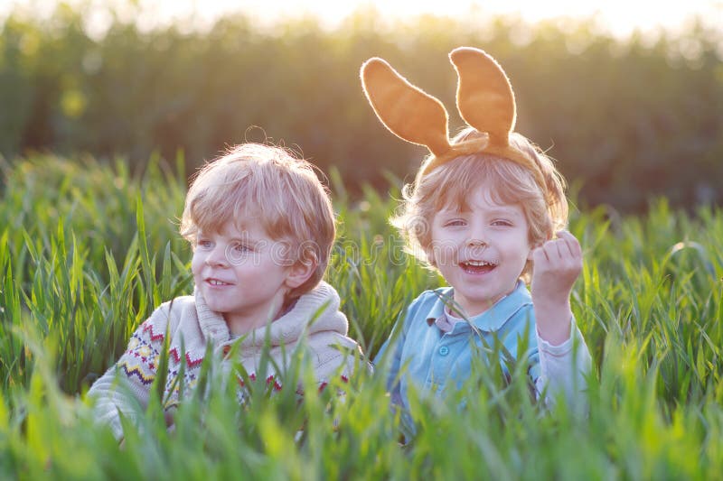 Two Children Playing with Easter Bunny Ears Stock Image - Image of ...