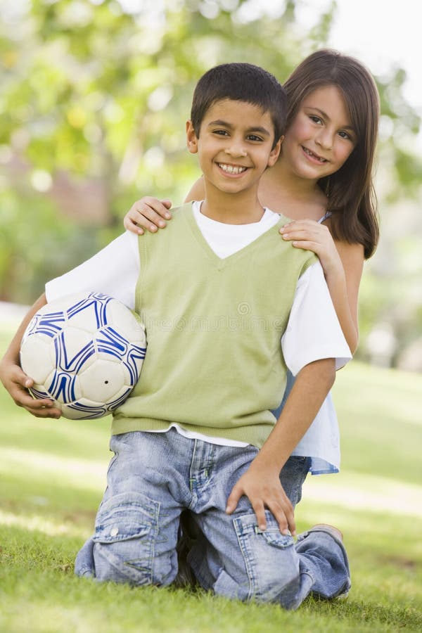 Two Children Playing in Park Together Stock Photo - Image of male ...
