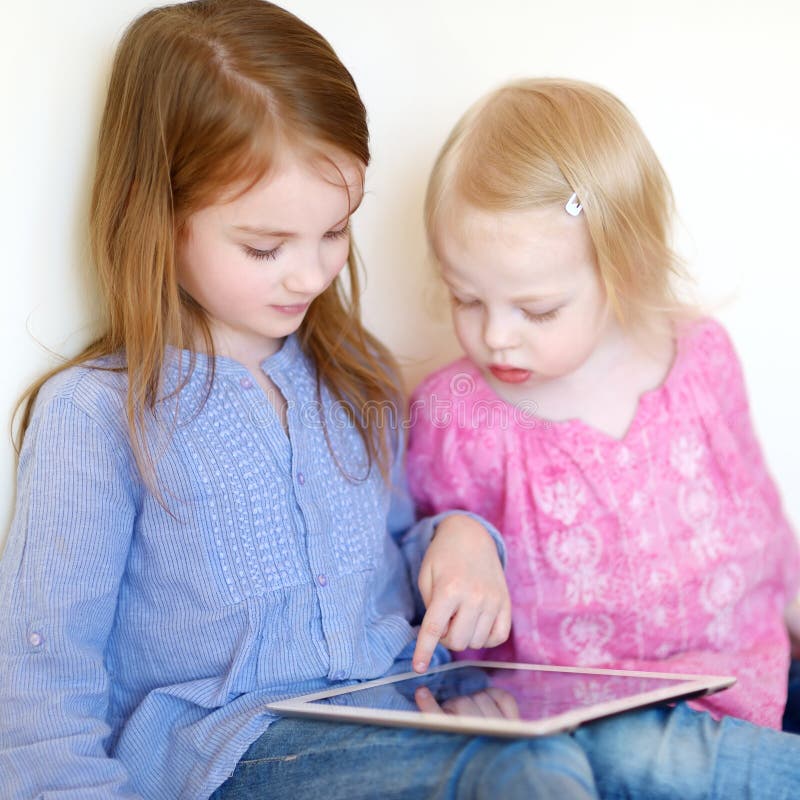 Two Children Playing with a Tablet at Home Stock Image - Image of happy ...