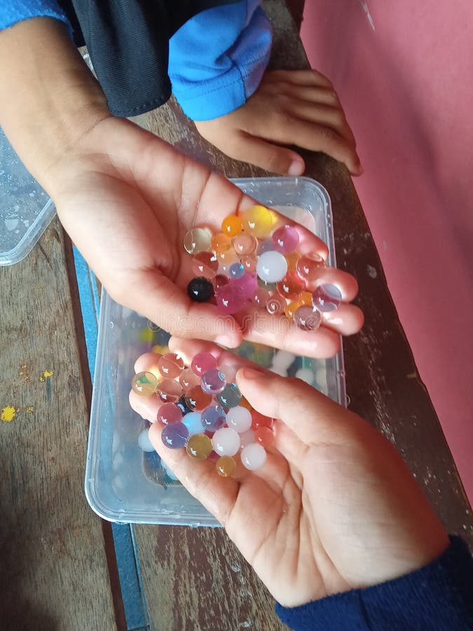 Two Children Playing Water Ball on a Board Stock Photo - Image of water ...