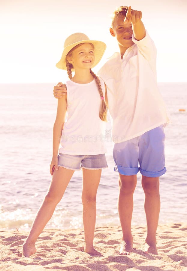 Children Pointing with Finger on Sandy Beach Stock Image - Image of ...
