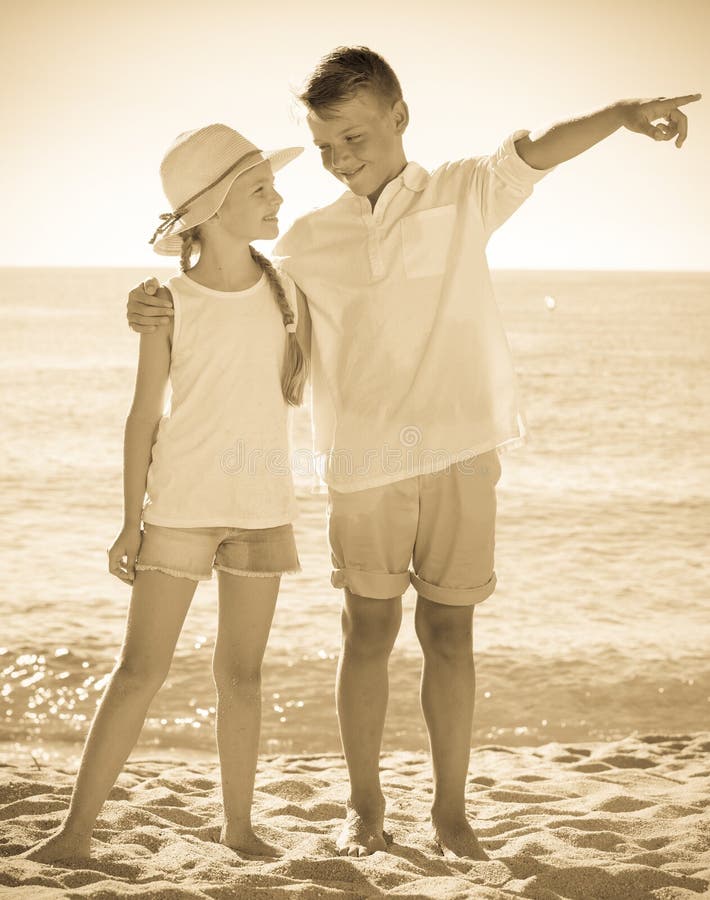 Children Pointing with Finger on Sandy Beach Stock Photo - Image of ...