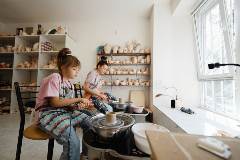 Young Artists Learn Pottery Techniques in a Bright Studio Environment ...