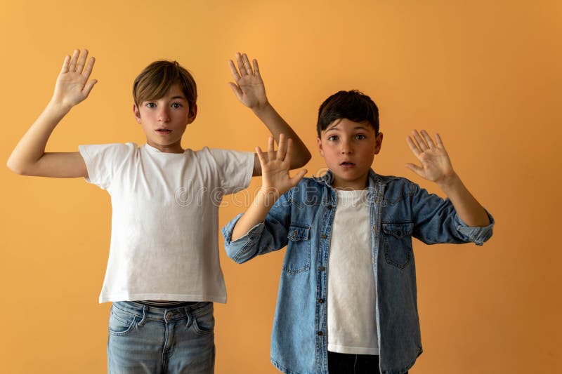 Two Children with Raised Hands and Scared Face Stock Image - Image of ...