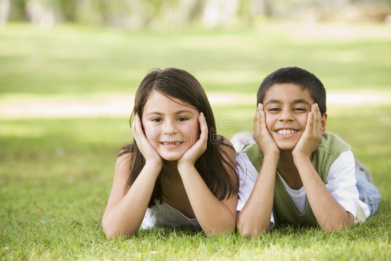 Two Children Relaxing Together, Smiling, Sitting in a Hammock Stock ...