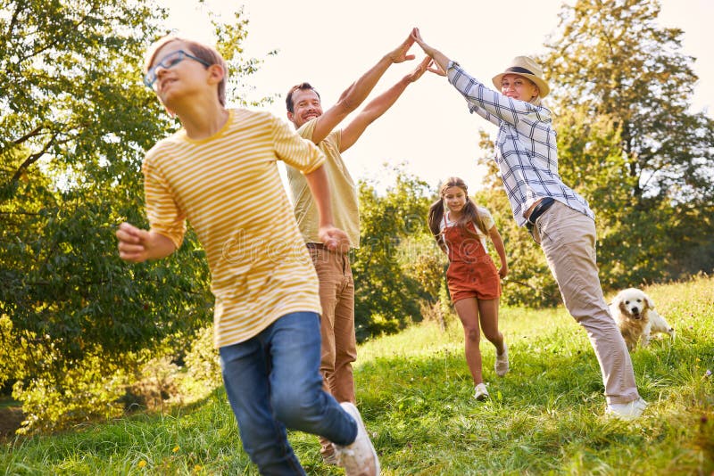 Two Children Run through Gate Formed from Hands Stock Photo - Image of ...