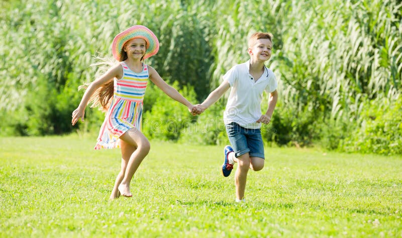 Two Children Running in Park Stock Photo - Image of grass, meadow: 88332098