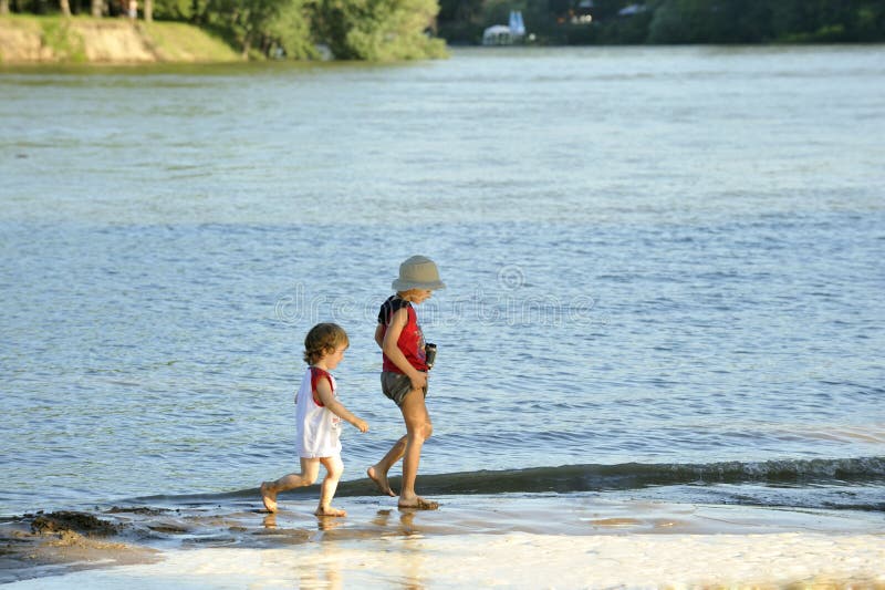 Children run in river stock photo. Image of river, beach - 32539852