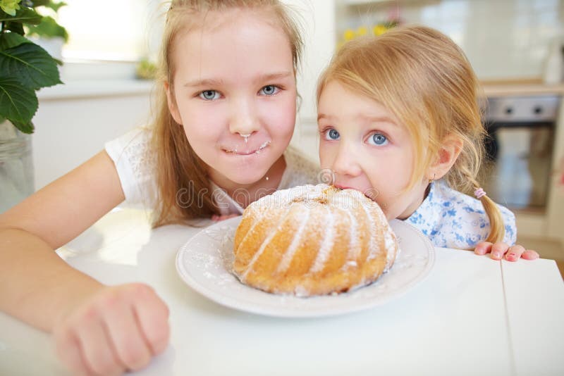 Two Children Secretly Snack on Cakes Stock Image - Image of family ...