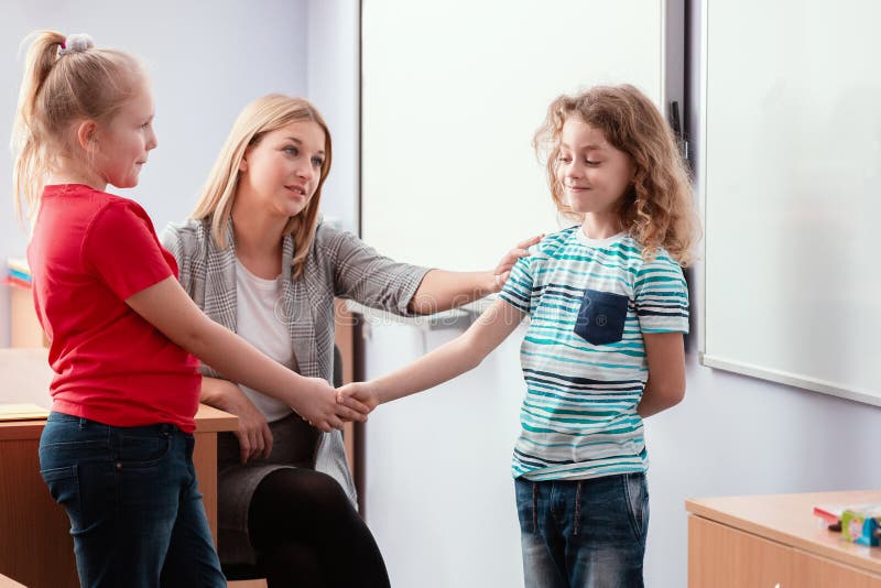 Children Shake Hands in Agreement during Class Stock Photo - Image of ...