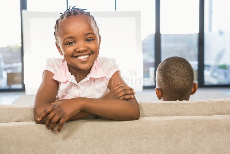Two Children Sitting on Sofa Stock Image - Image of crossed, living ...