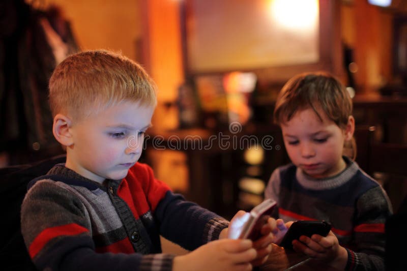 Two Children with Smartphones Stock Image - Image of casual, people ...