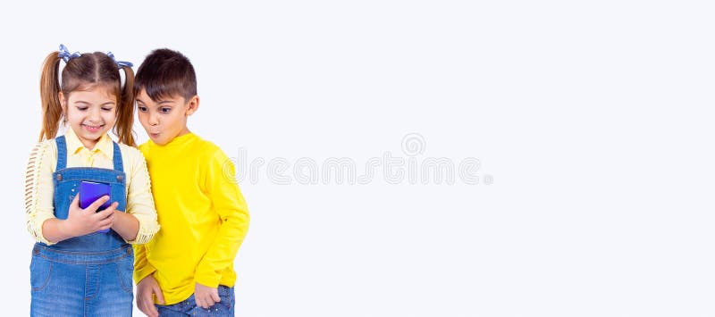 Two Children Smiling and Surprised Expression Looking To Screen ...