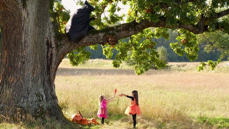 Two Children are Standing Under a Tree, on Which a Reaper is Sitting ...