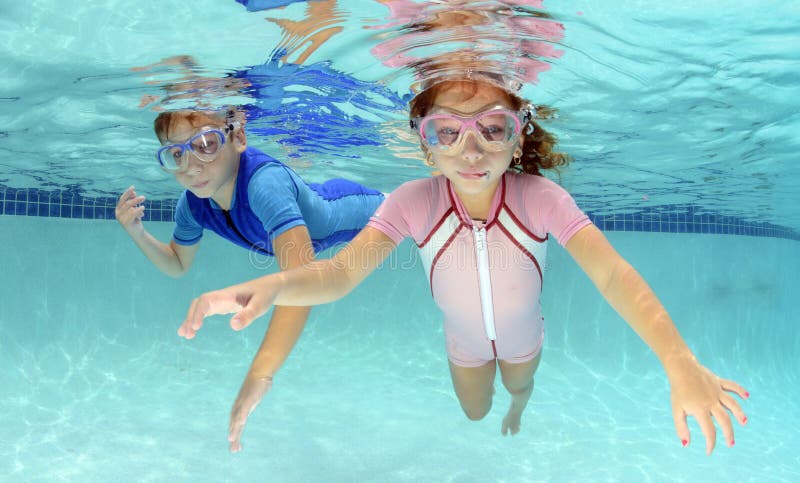 Two Children Swimming Underwater in Pool Stock Image - Image of summer ...