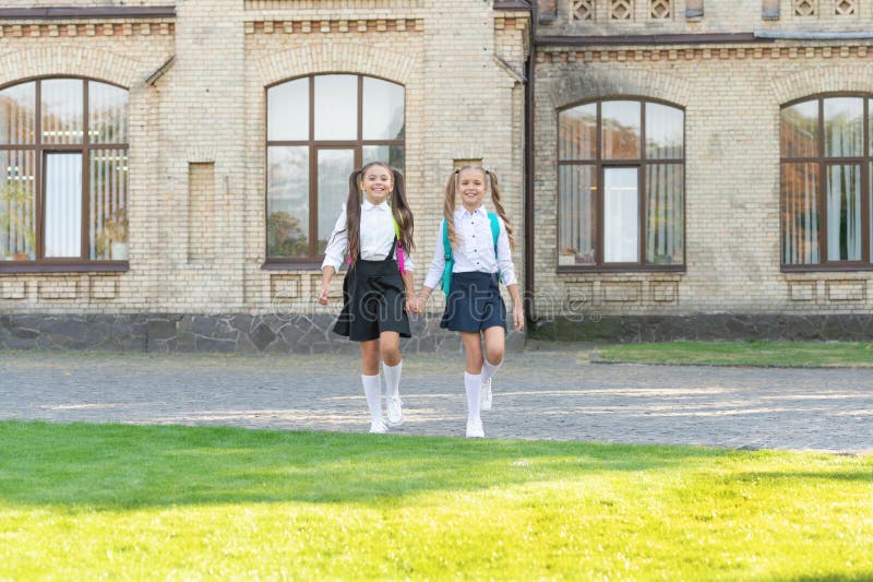 Two Children in Uniform Walking Together Outdoor Stock Photo - Image of ...