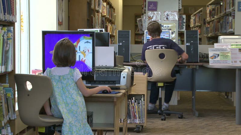 Two Children Using the Computers at the Library Stock Footage - Video ...