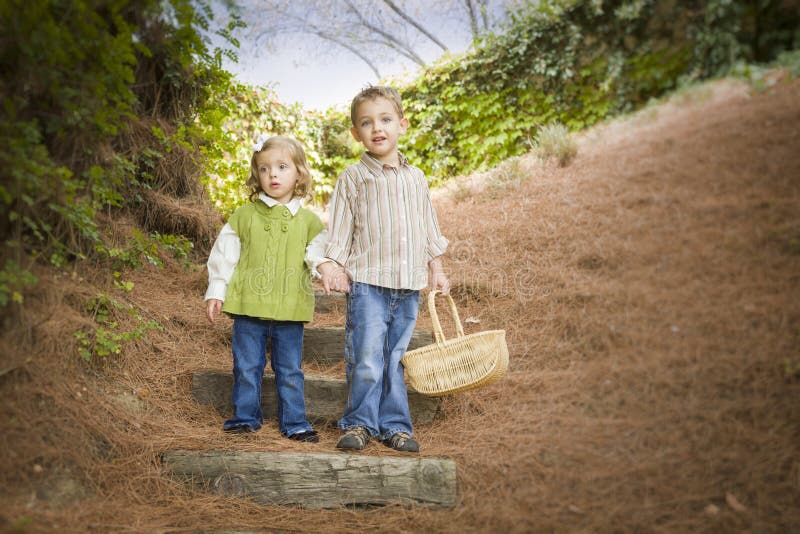 Two Children Walking Down Wood Steps with Basket Outside. Stock Image ...