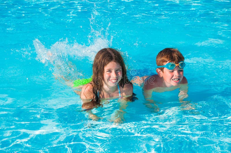 Two children in water stock photo. Image of swim, lifestyle - 76733830