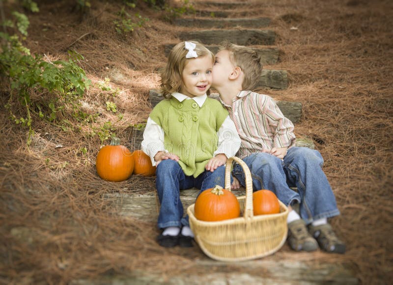 Two Children on Wood Steps with Pumpkins Whisperi Stock Image - Image ...