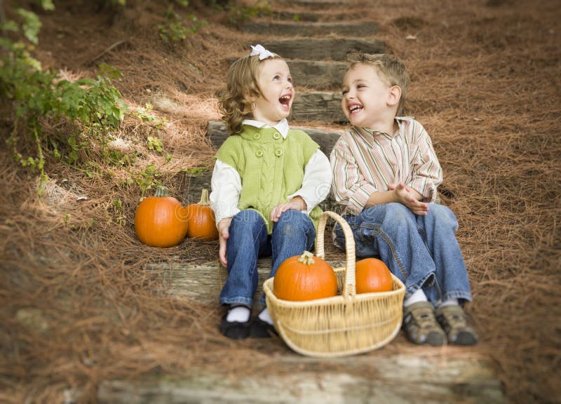 Two Children on Wood Steps with Pumpkins Whisperi Stock Photo - Image ...