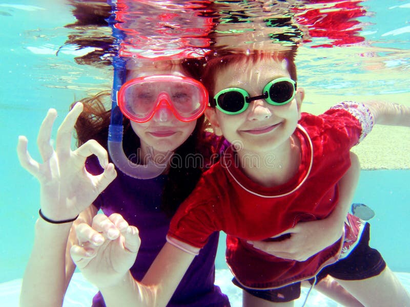 Two chilldren underwater stock photo. Image of splash - 67215990