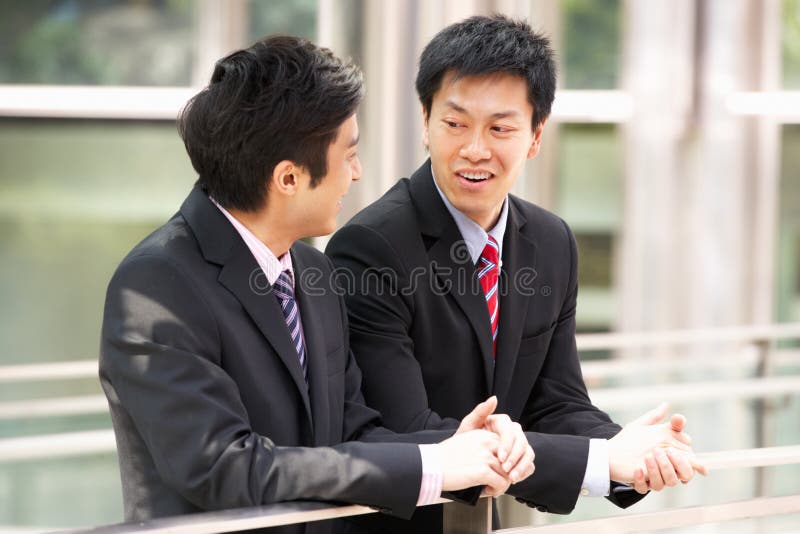 Two Chinese Businessmen Outside Modern Office Stock Photo - Image of ...