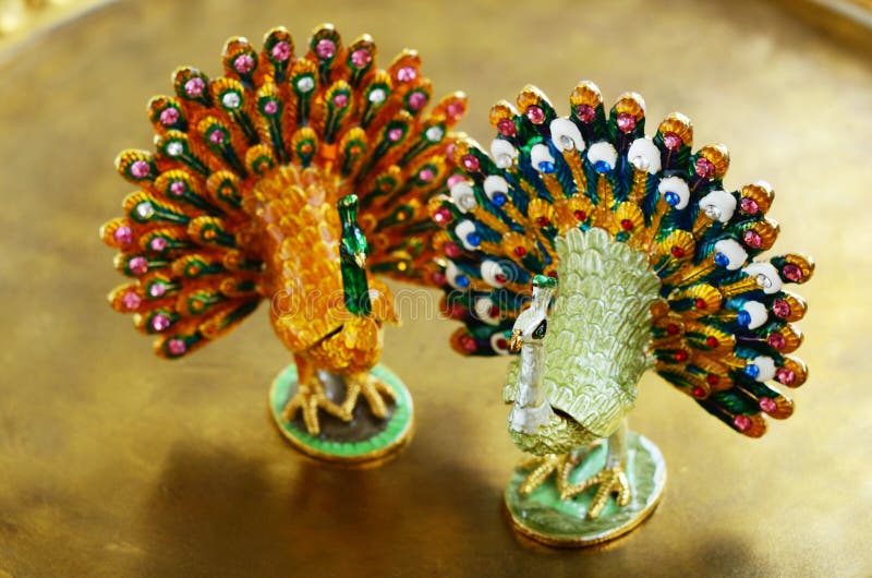 Two Chinese Peacock Statuette on Golden Background Stock Photo - Image ...
