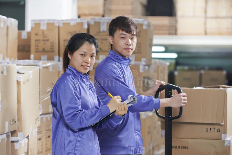Two Chinese Workers in Warehouse Stock Image - Image of manufacturing ...
