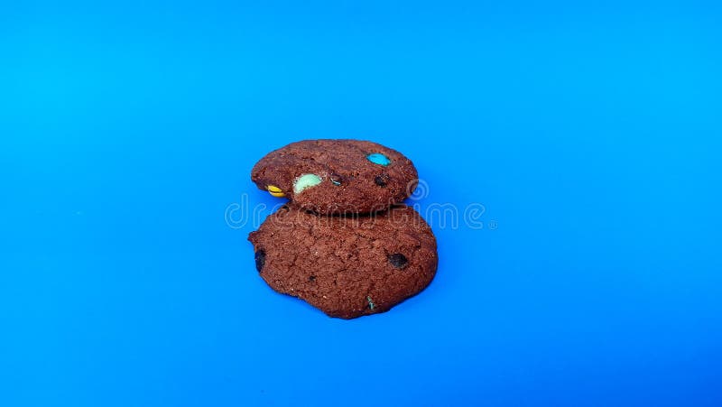 Two Chocolate Chip Cookie on Blue Background. Stock Photo - Image of ...