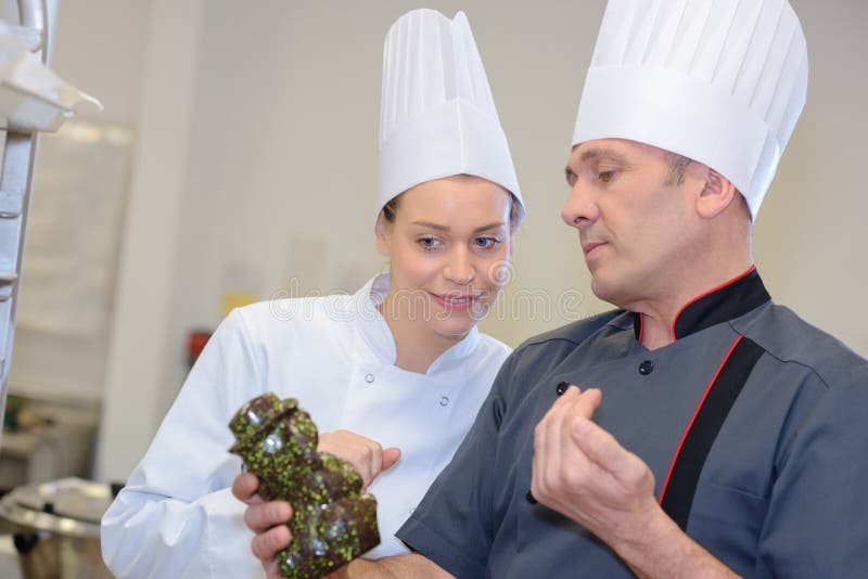 Two Chocolate Workers Talking Stock Photo - Image of oven, equipment ...
