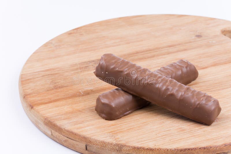 Two Chocolates on a Wooden Board Stock Image - Image of dark ...
