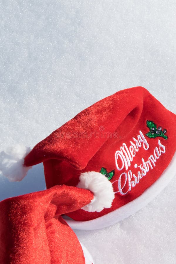 Two Christmas Red Hats on the White Snow Stock Photo - Image of style ...