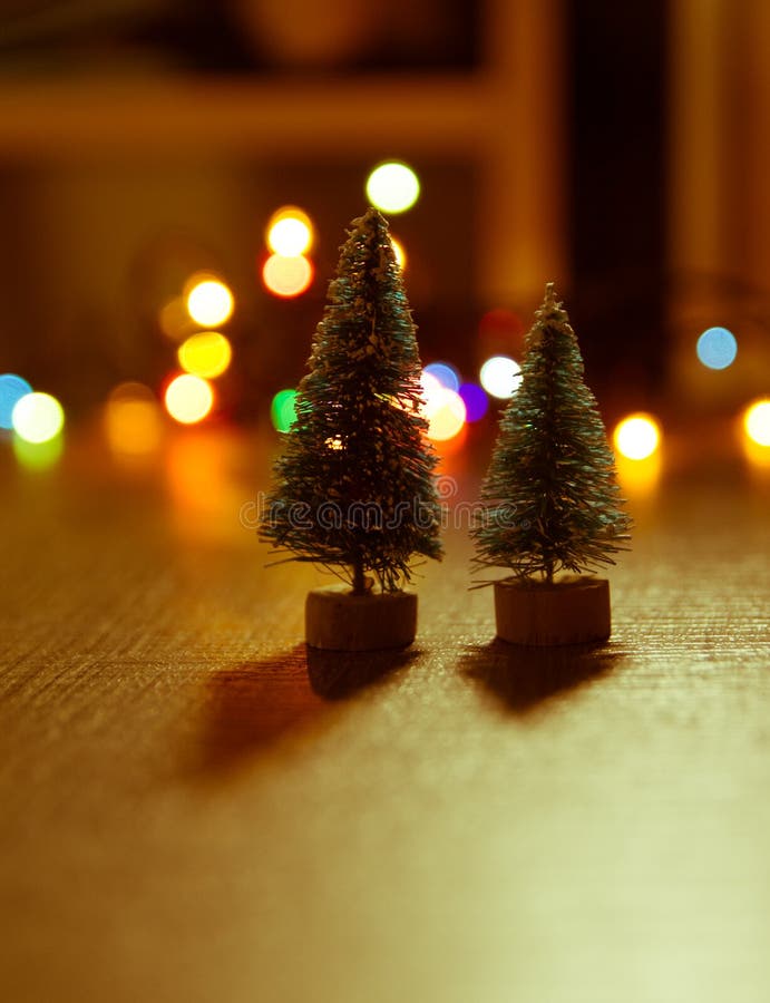 Two Christmas Trees on the Background of Bright Gifts, Colored Lights ...