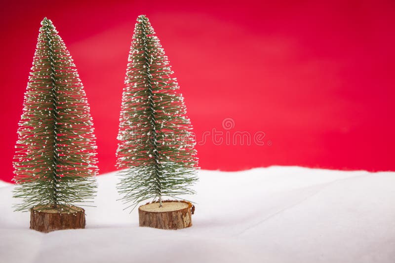 Two Christmas Trees on Snow, Red Background Stock Image - Image of ...