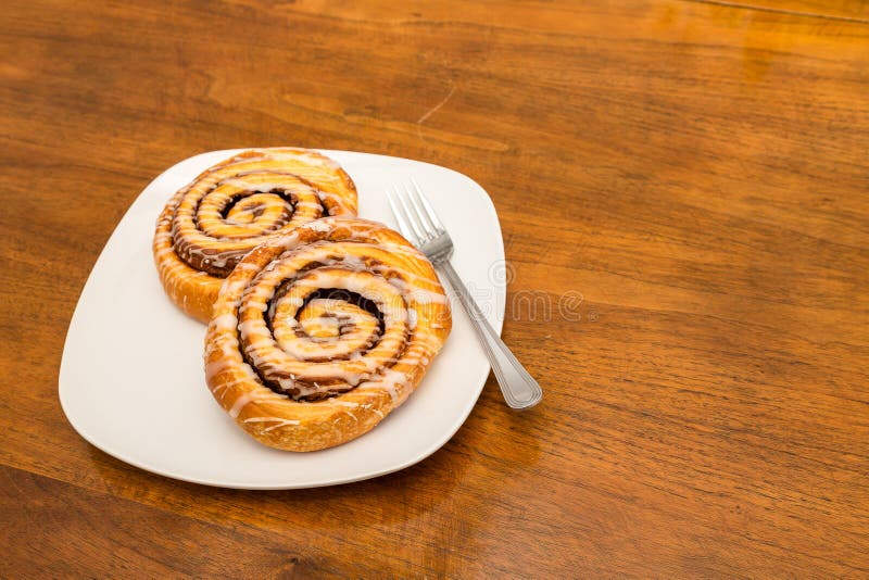 Two Cinnamon Rools on Square Plate with Fork Stock Image - Image of ...