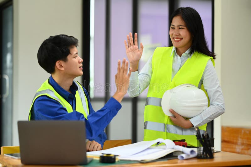 Two Civil Engineer Giving Each Other High Five, Celebrating for ...