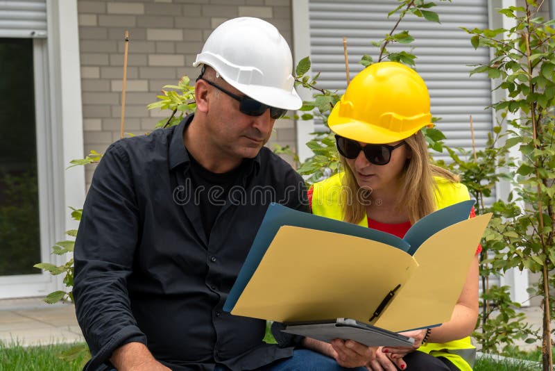 Two Civil Engineers at Work Stock Image - Image of project, helmet ...