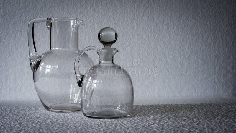 Two clear glass pitchers stock photo. Image of water - 95696144