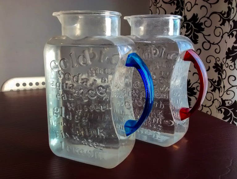 Two Full Water Pitchers on Table Stock Image - Image of languages ...