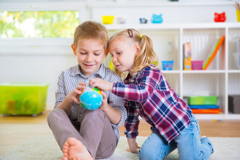 Two Clever Children Exploring Globe Stock Image - Image of elementary ...