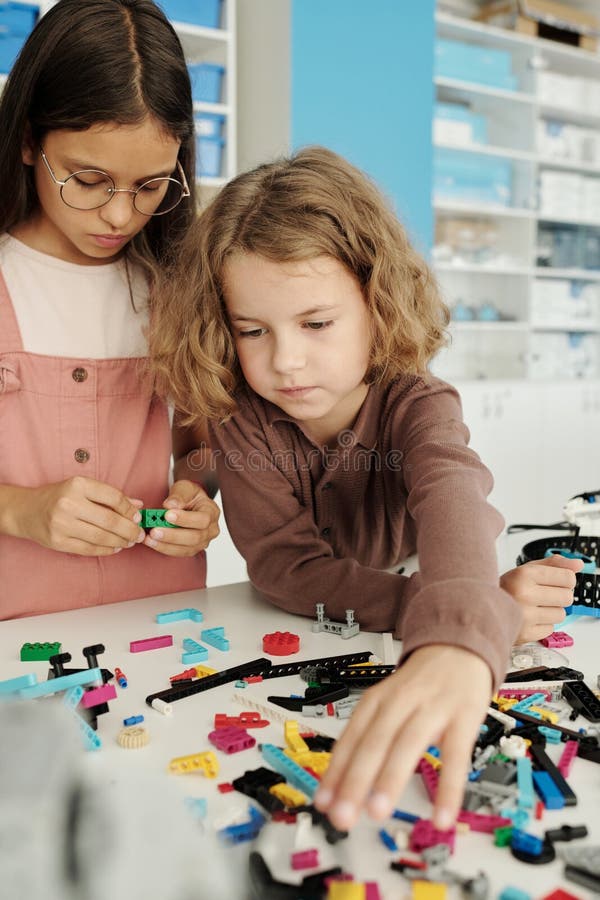 Two Clever Classmates Connecting Details of Robot while Boy Taking ...