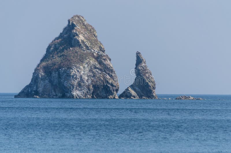 Two Cliffs in the Middle of the Sea Stock Photo - Image of countryside ...