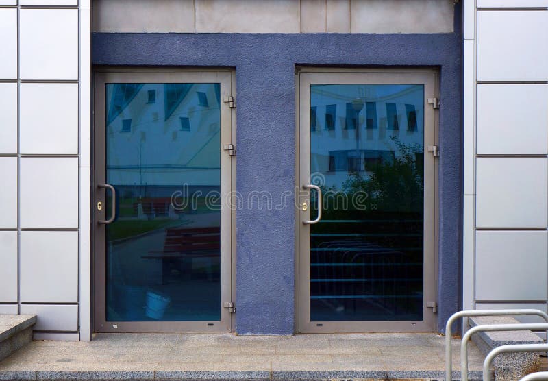 Two Closed Glass Entrance Doors of Modern Building Stock Image - Image ...
