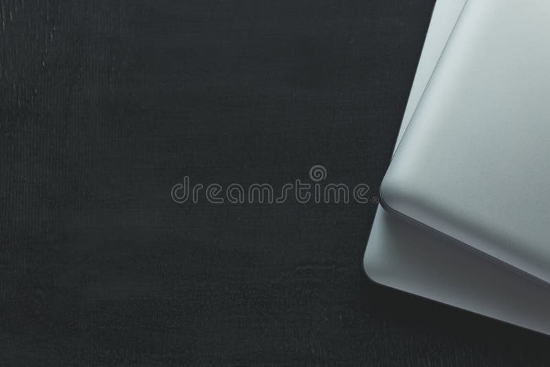 Two Closed Laptops on Modern Wooden Desk Stock Photo - Image of ...