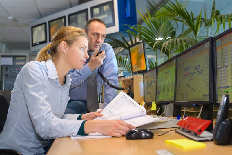Two Co-workers Discussing Papers in Tv Studio Stock Photo - Image of ...
