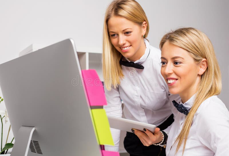 Two Co-workers Working on Computer Stock Photo - Image of cooperation ...