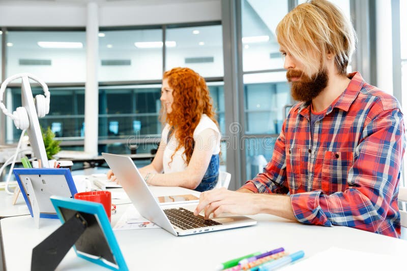 Two Co-workers Working Together Stock Photo - Image of designer ...