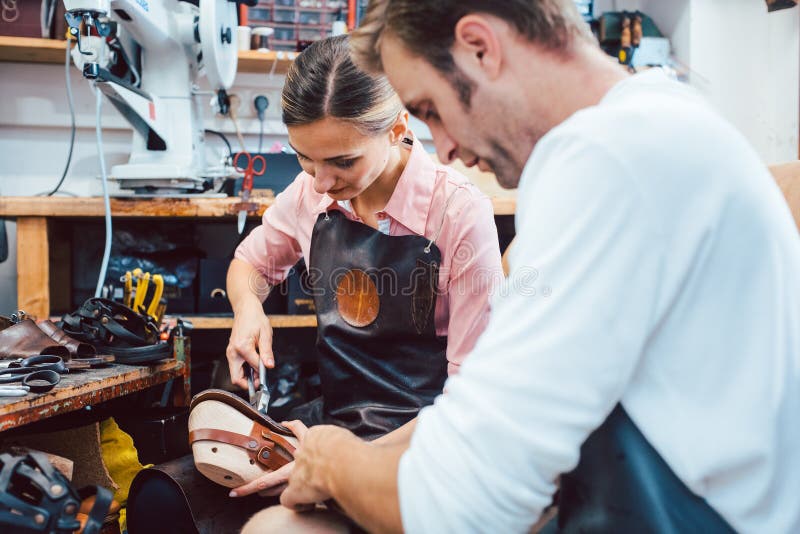 Two Cobblers Working Together in the Workshop Stock Photo - Image of ...