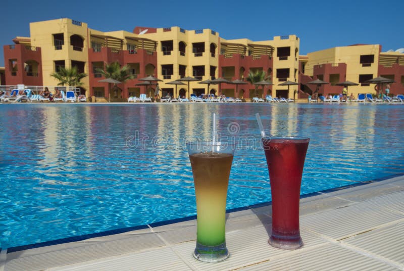 Two Cocktail Drinks by a Tropical Swimming Pool Stock Image - Image of ...
